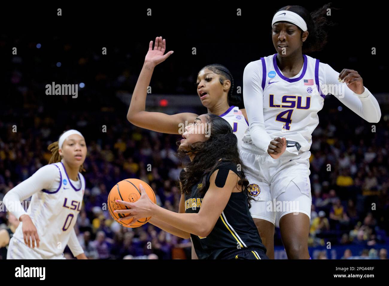 Michigan guard Laila Phelia (5) shoots against LSU forward Angel Reese, center, and guard Flau ...