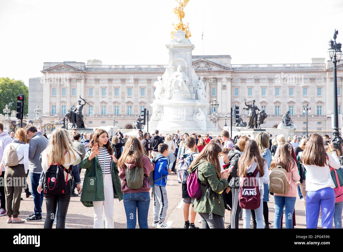 People walk around Buckingham Palace in London on the first Saturday ...