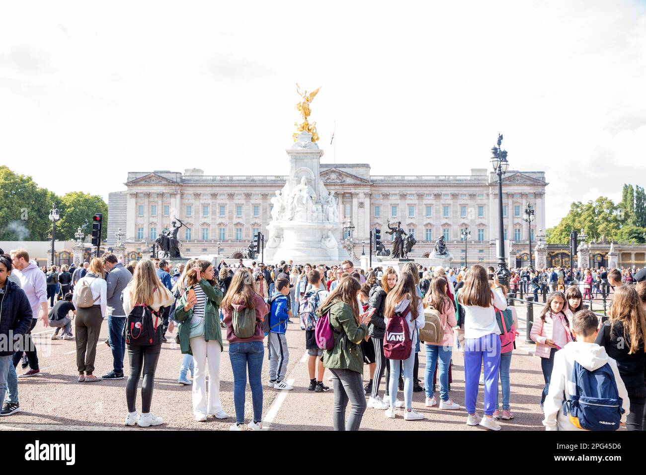 People walk around Buckingham Palace in London on the first Saturday ...