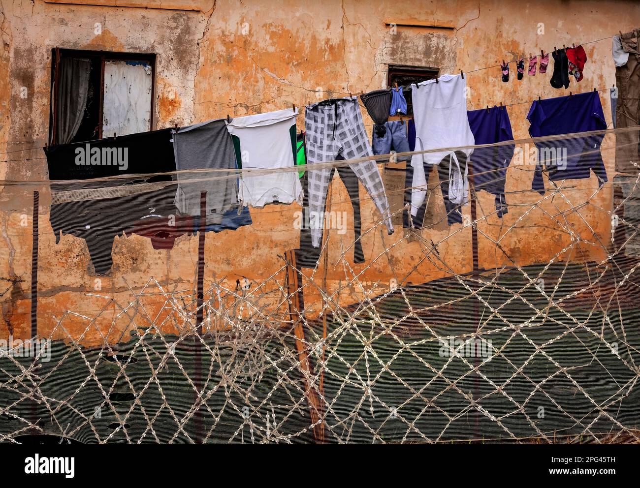 A house in Haarlem with washing hanging behind a razor wire fence Stock ...