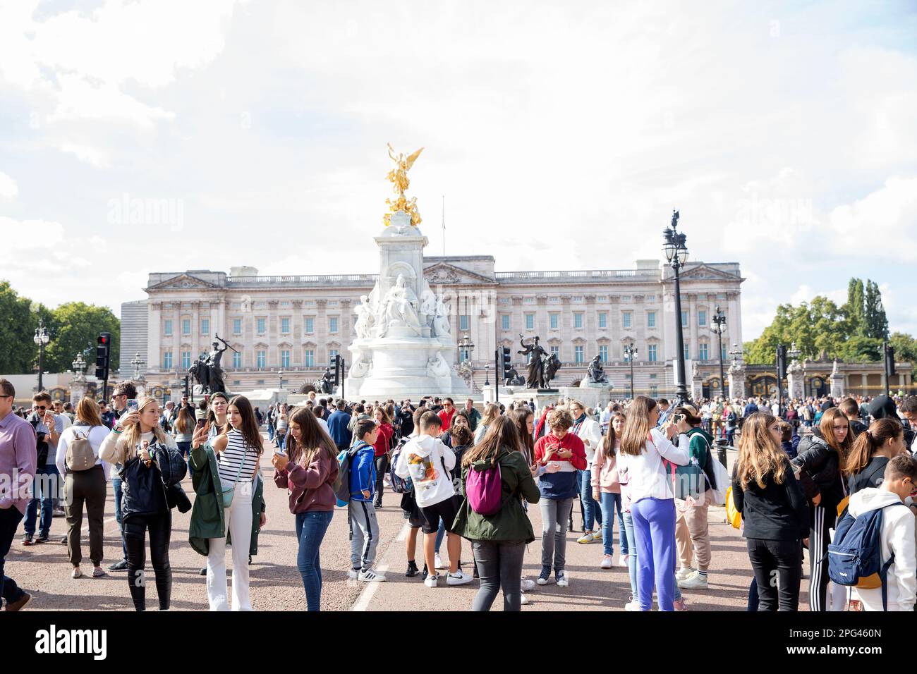 People walk around Buckingham Palace in London on the first Saturday ...