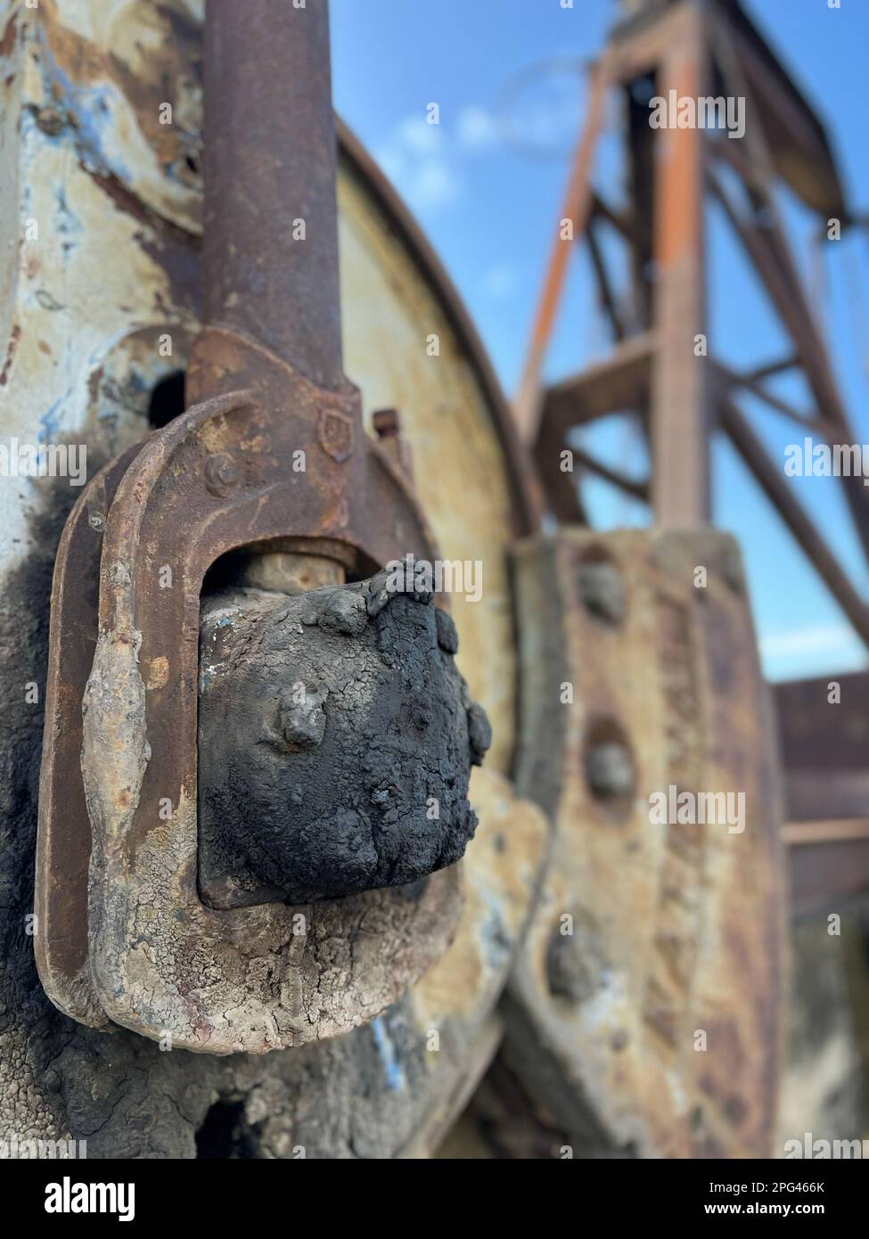 A closeup shot of aged industrial machine rust-covered surfaces showing ...