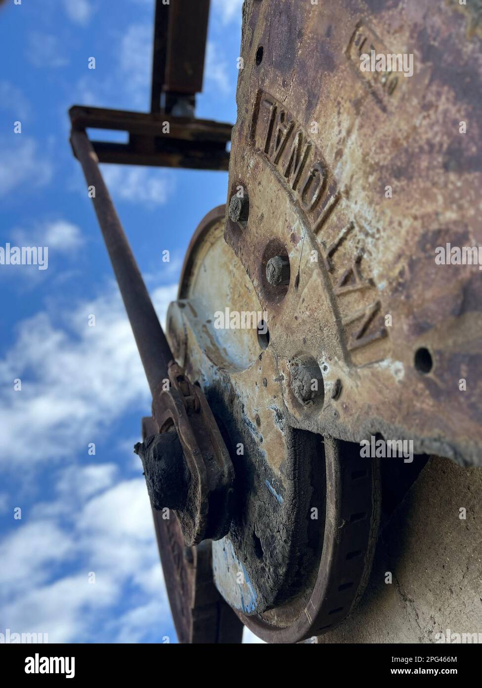 A closeup shot of aged industrial machine rust-covered surfaces showing ...