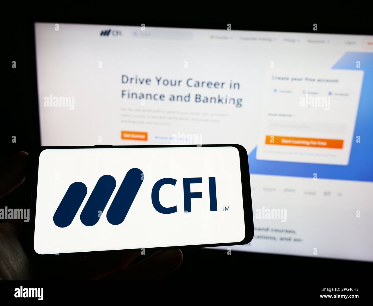 Person holding mobile phone with logo of company Corporate Finance ...