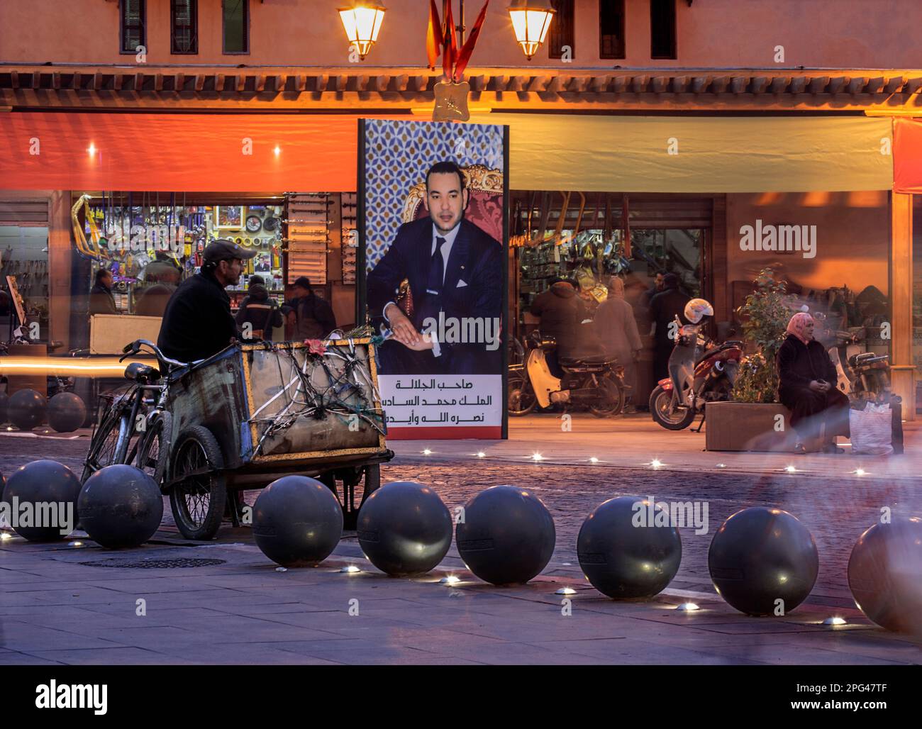 A poster of his Majesty King Mohammed V1 looks on a street scene on the ...