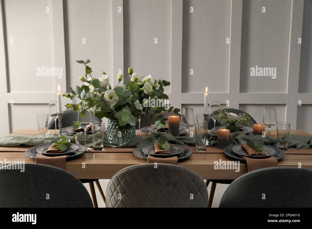 Festive table setting with beautiful floral decor indoors Stock Photo ...