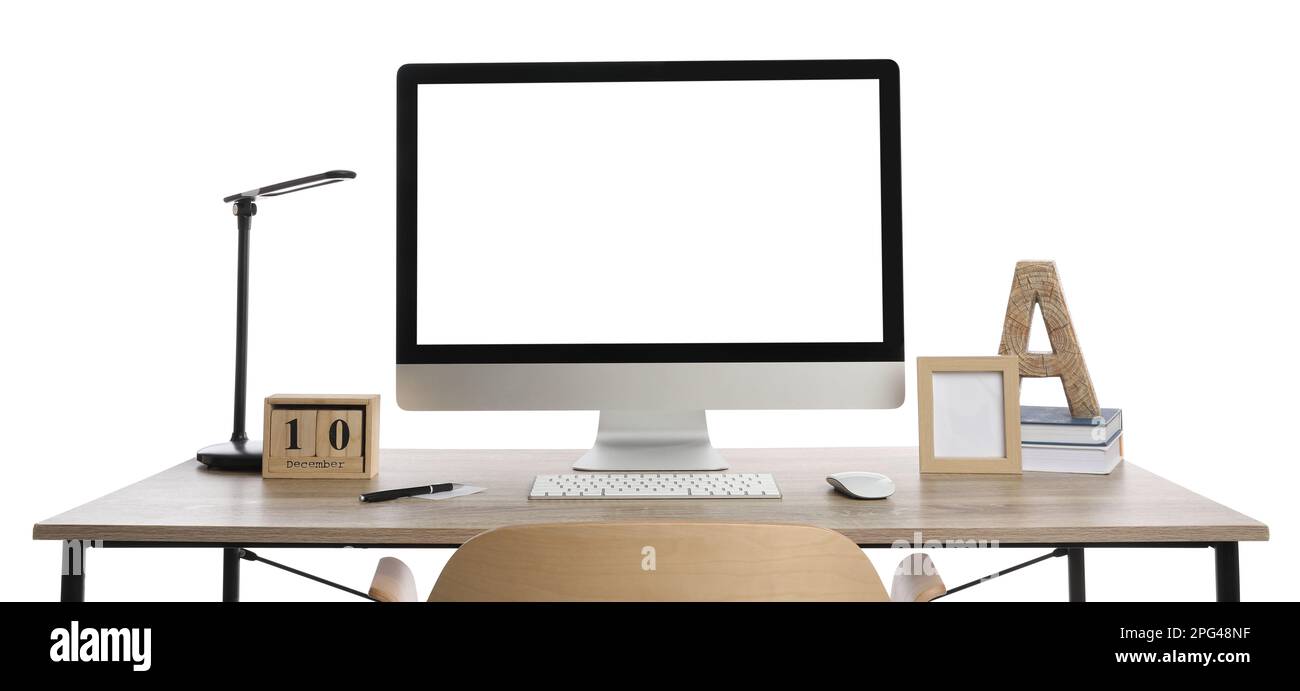 Wooden table with modern computer, decor and stationery on white ...