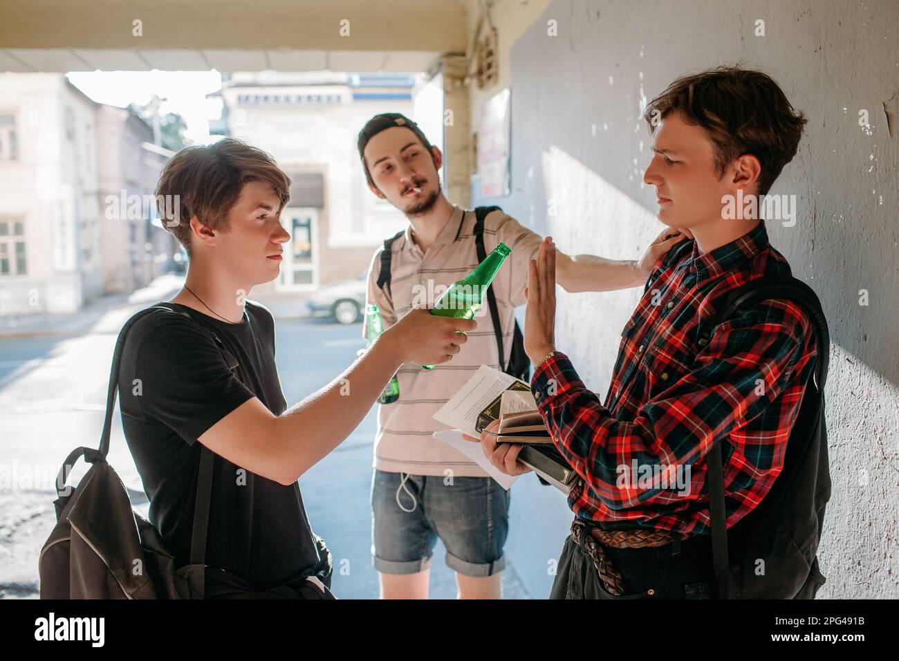 teenage bad influence refusal smoking urban youth Stock Photo - Alamy