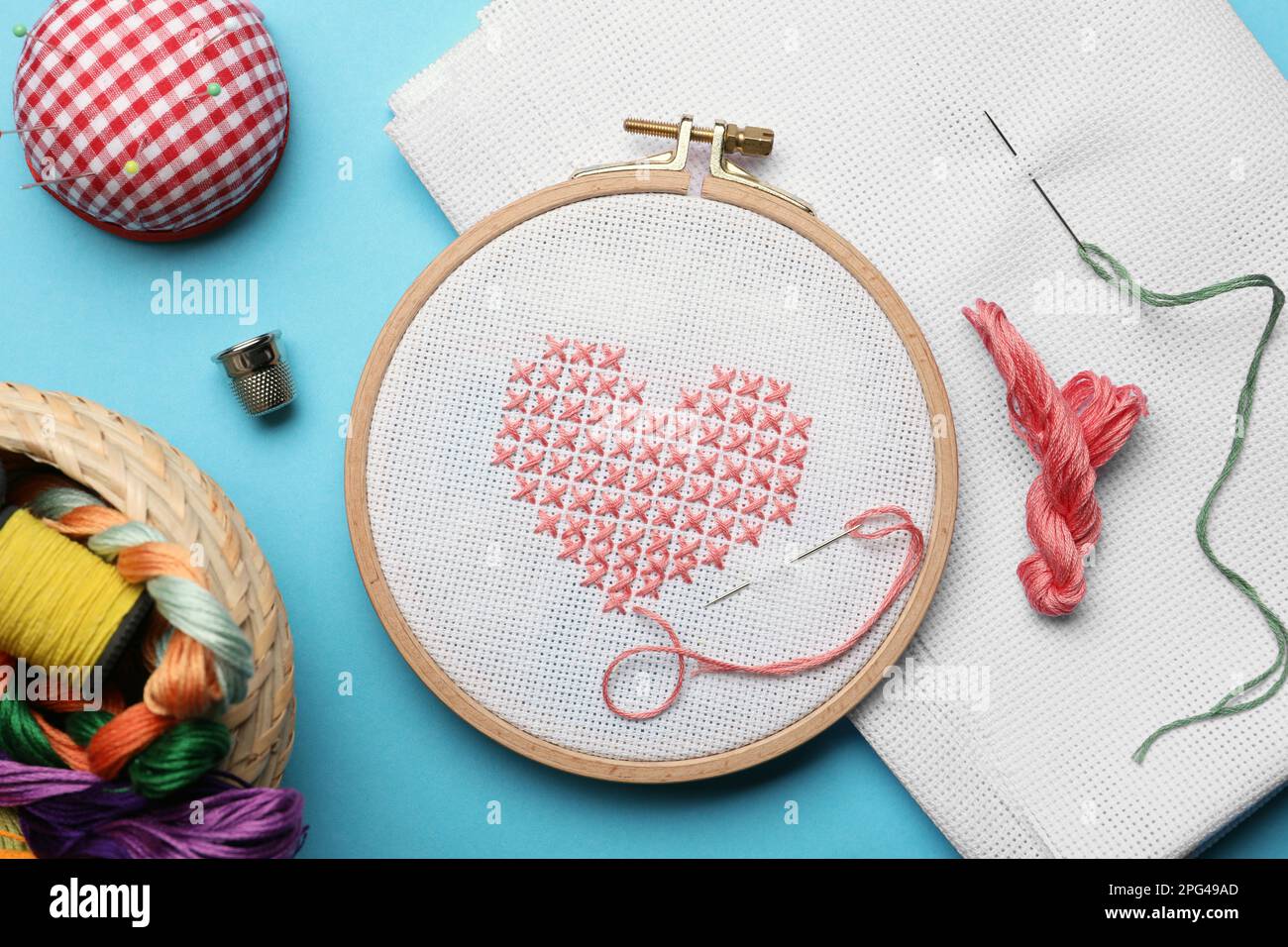 Flat lay composition with embroidery and different sewing accessories ...