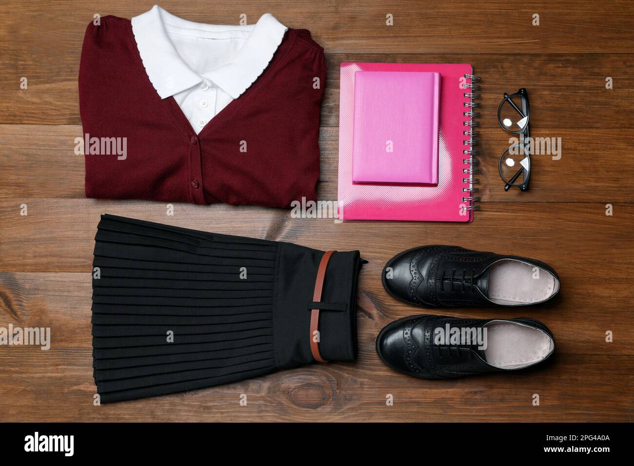 Stylish School Uniform Glasses And Notebooks On Wooden Background