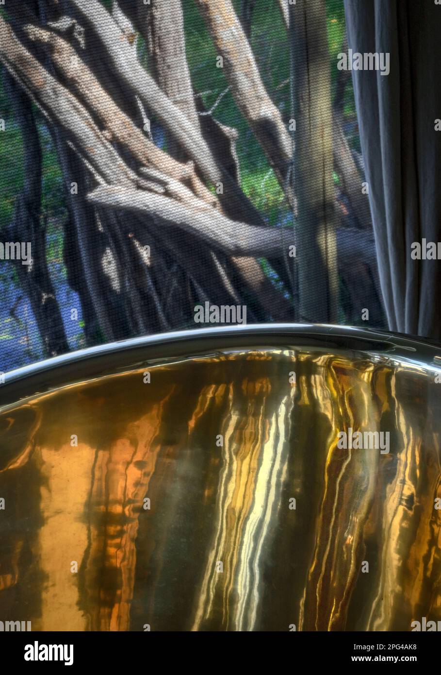 A brass and copper bath in a tented room in the Duba Plains Camp in the ...