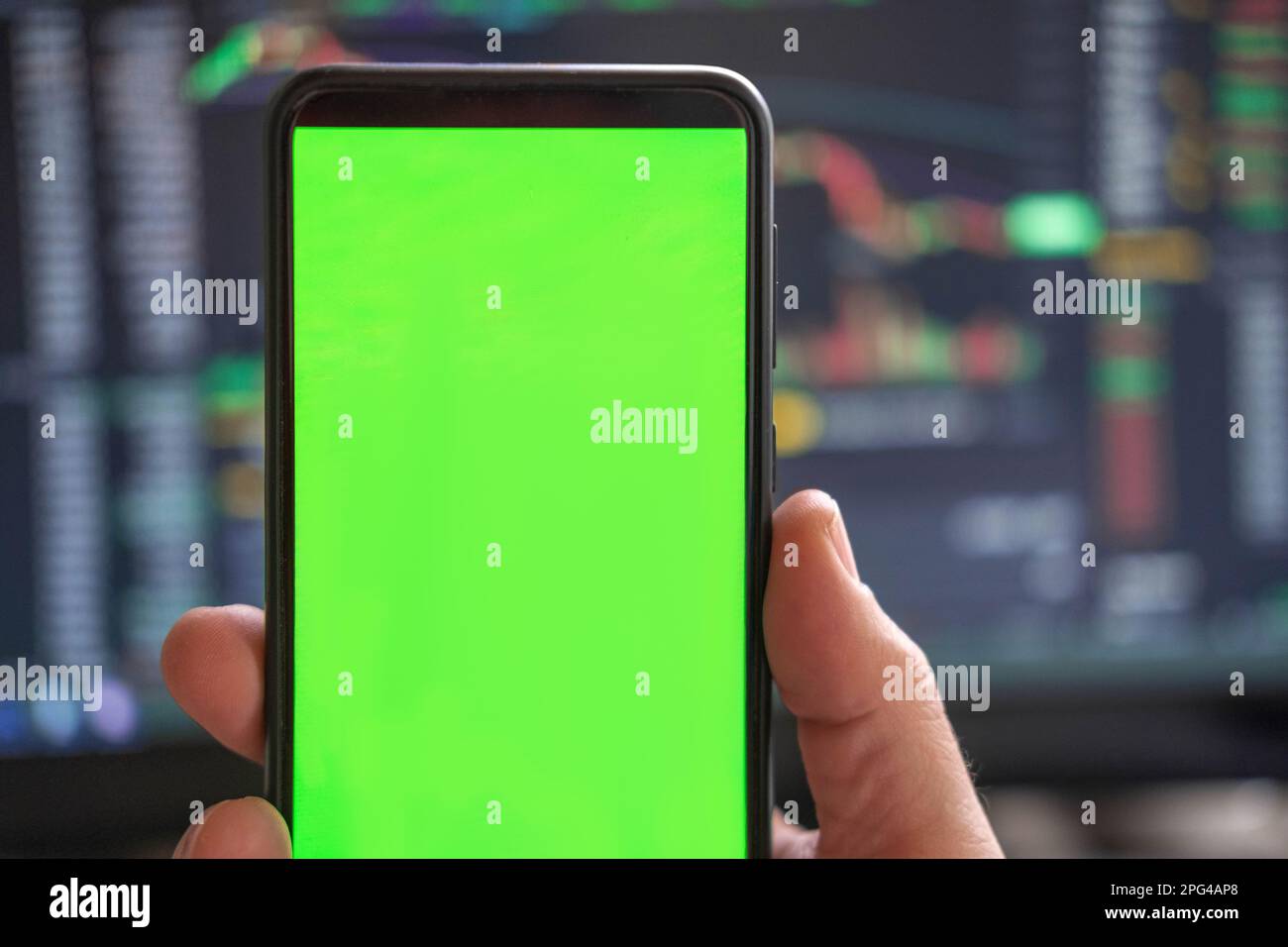 Black phone with blank mockup screen on rising stock graph. Closeup ...