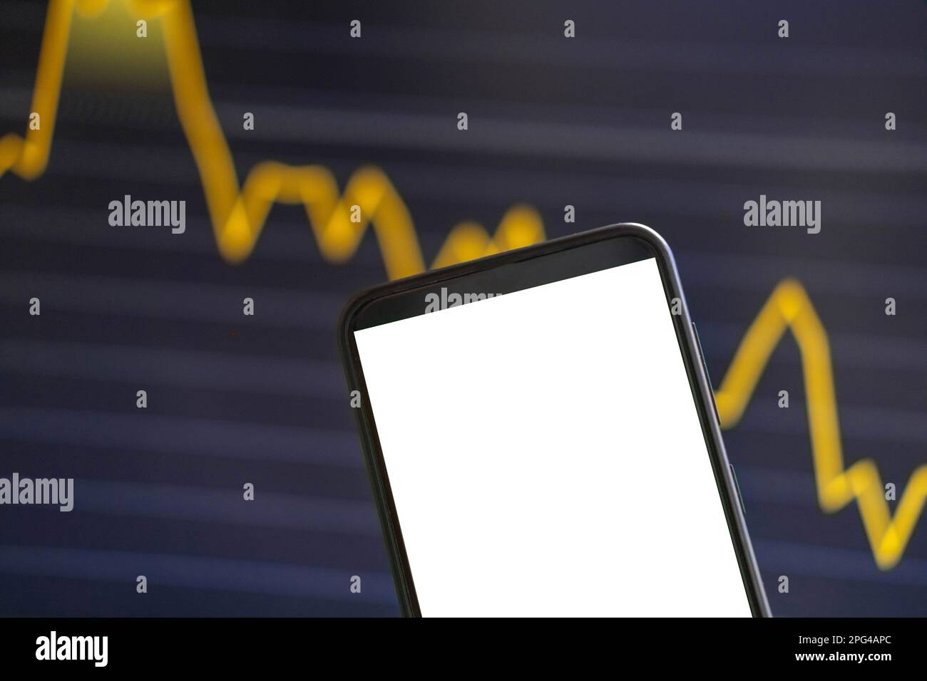 Black phone with blank mockup screen on rising stock graph. Closeup ...