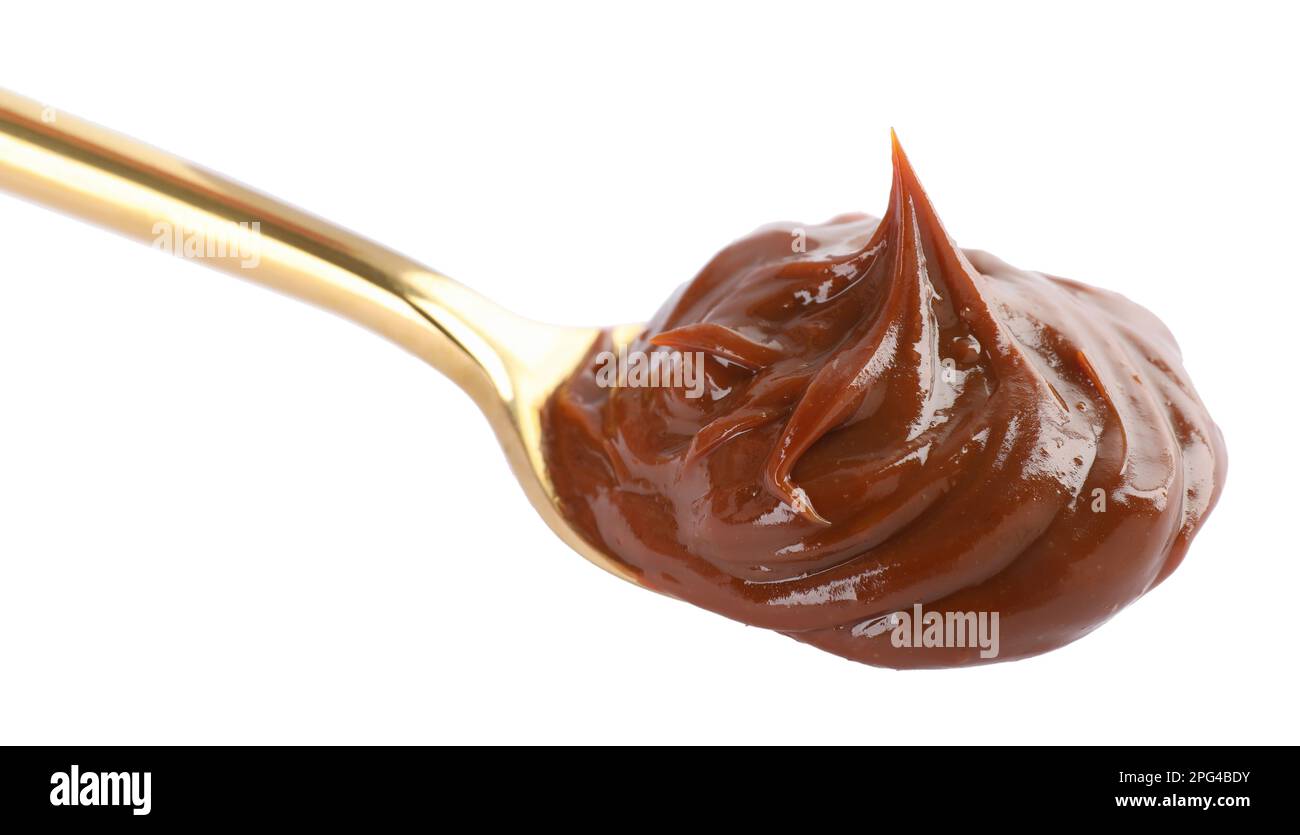Spoon with tasty boiled condensed milk isolated on white Stock Photo ...