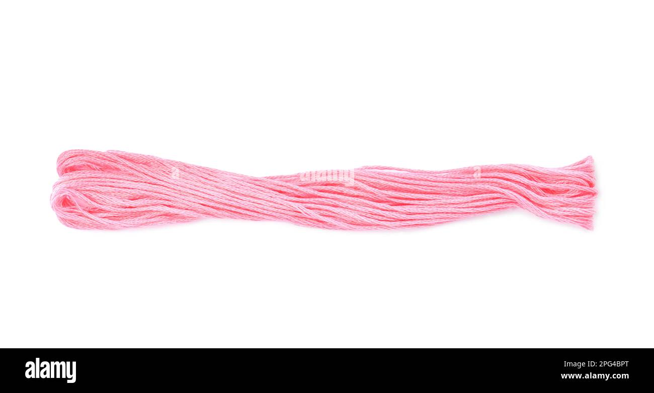 Bright pink embroidery thread on white background Stock Photo - Alamy