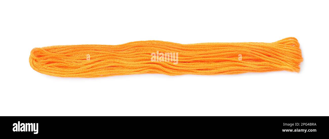 Bright orange embroidery thread on white background Stock Photo - Alamy