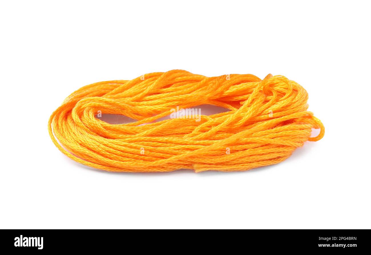 Light orange embroidery thread on white background Stock Photo - Alamy
