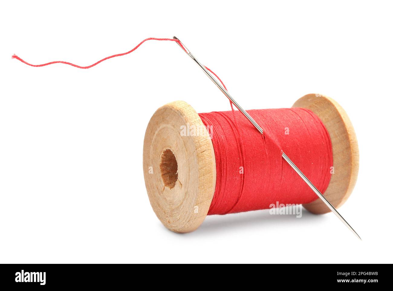 Red sewing thread with needle on white background Stock Photo - Alamy