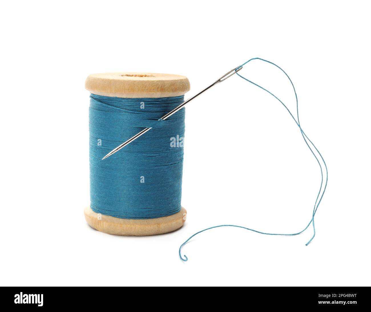 Light blue sewing thread with needle on white background Stock Photo ...