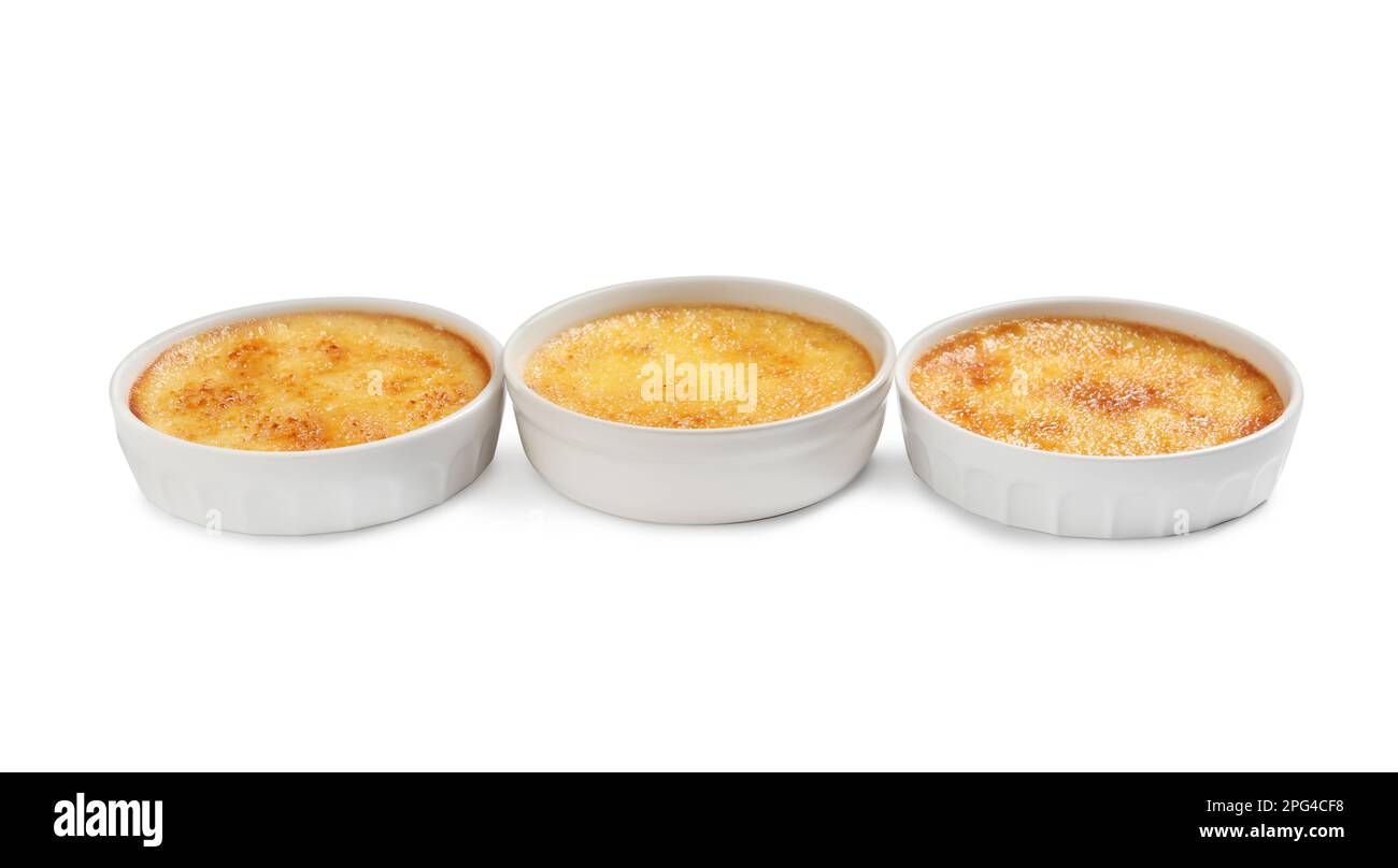 Delicious creme brulee in ceramic ramekins on white background Stock ...
