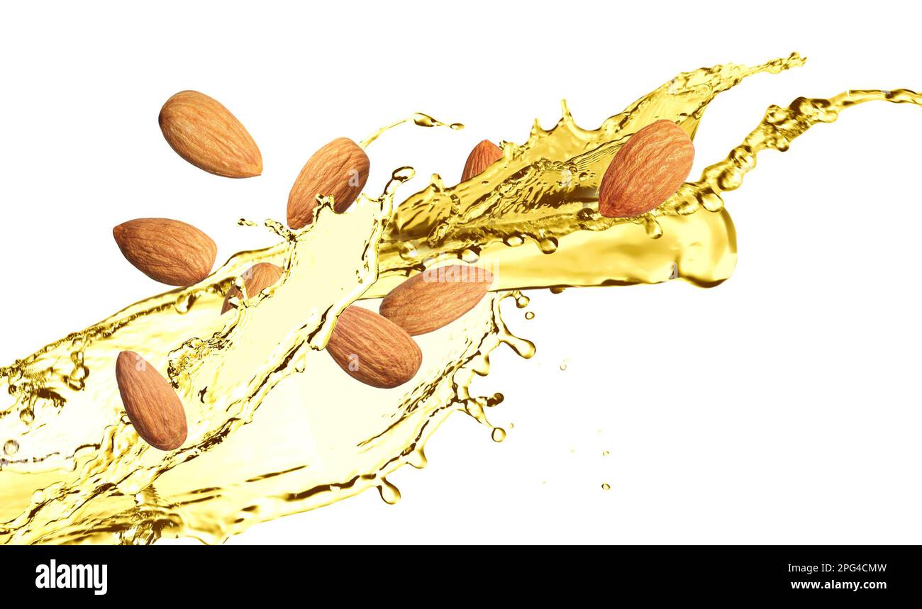 Organic almond oil and tasty nuts flying on white background Stock ...