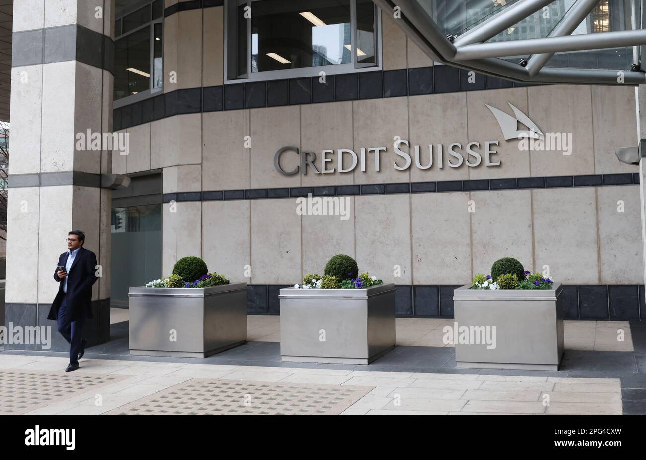 London, UK. 20th Mar, 2023. A Member of the public walks past Swiss ...