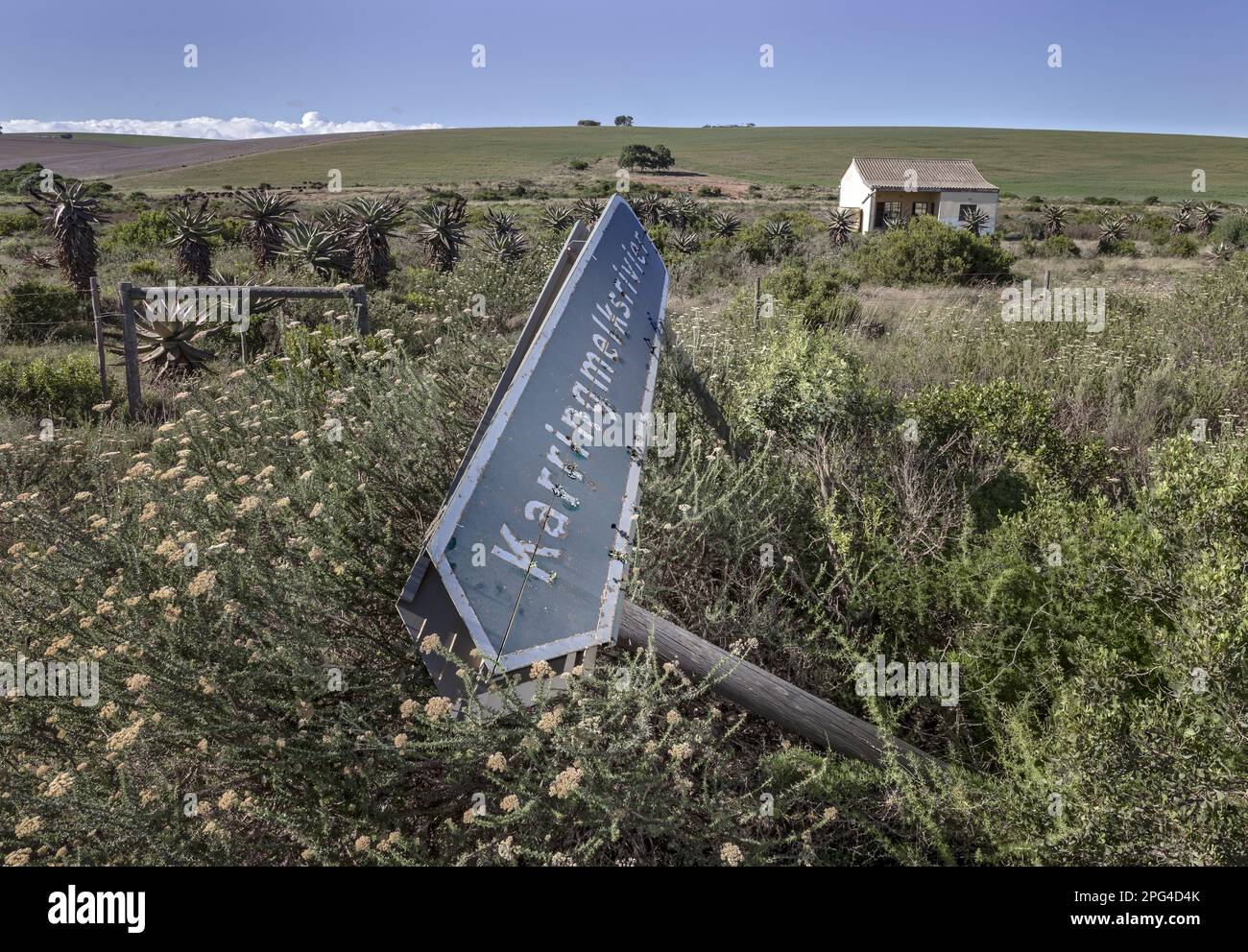 A fallen road sign showing the way to Karringsmelkrivier ( Buttermilk ...