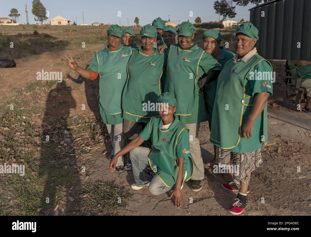 A group of Kromco fruit packers pose for me at a bus-stop in Genadendal ...