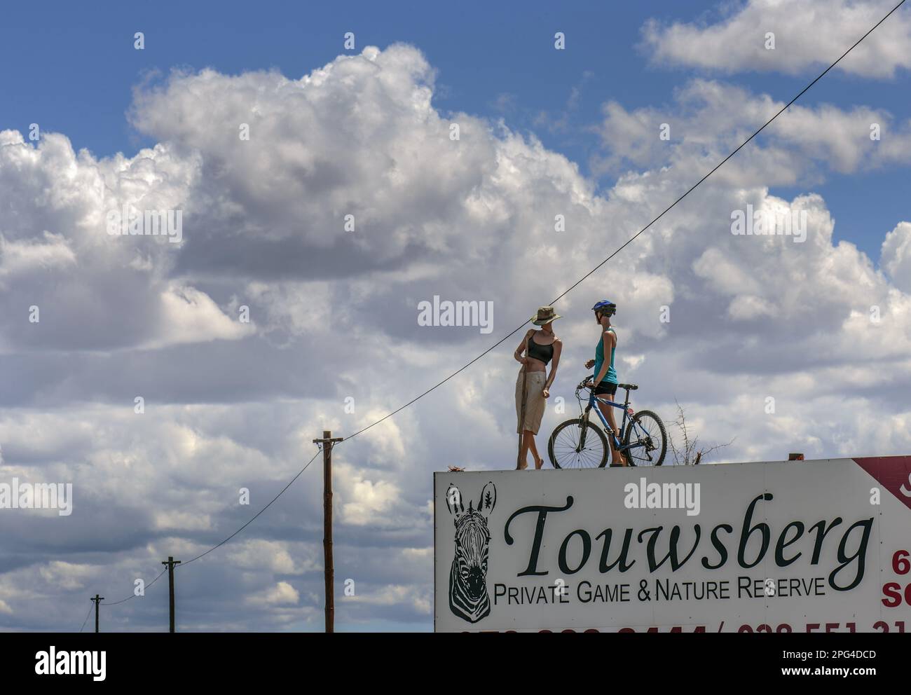 a large advertising sign for the Touwsrivier Game Reserve with figures ...