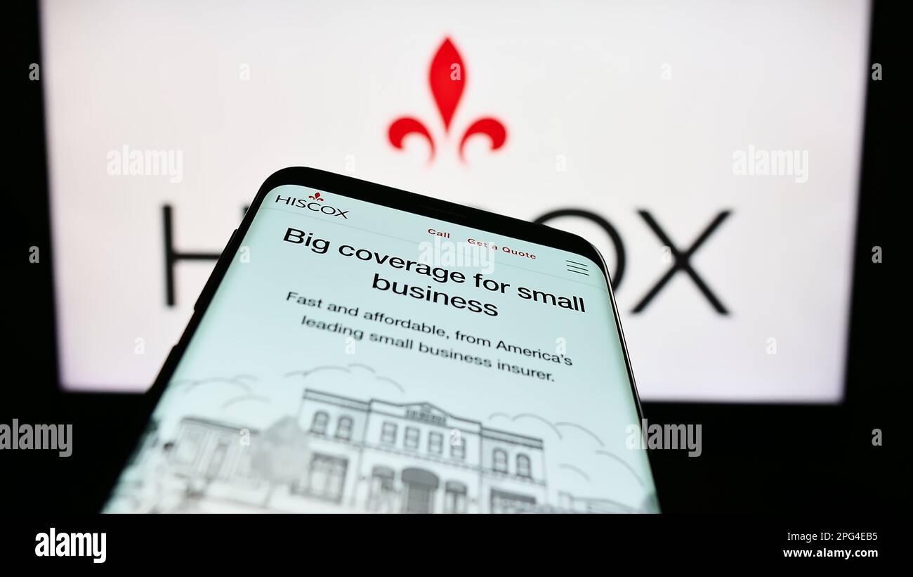 Smartphone with website of insurance company Hiscox Ltd. on screen in ...