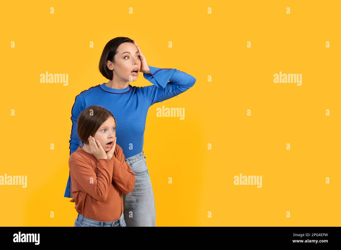 Omg. Shocked Mother And Daughter Looking Aside With Open Mouth Stock ...