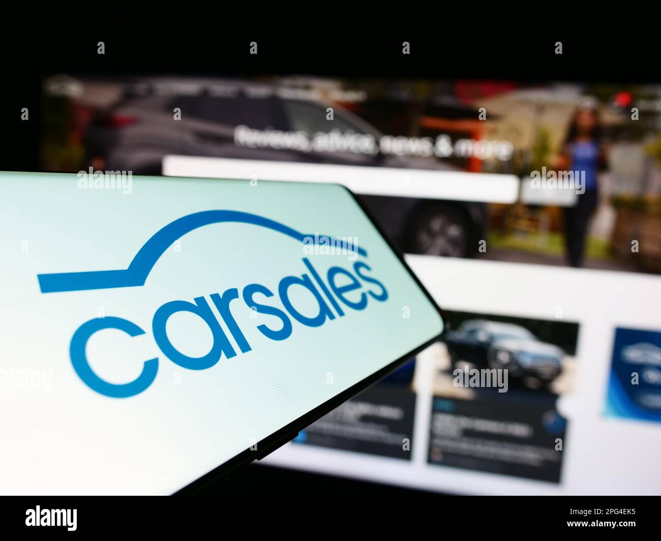 Smartphone with logo of Australian company carsales.com Ltd. on screen ...