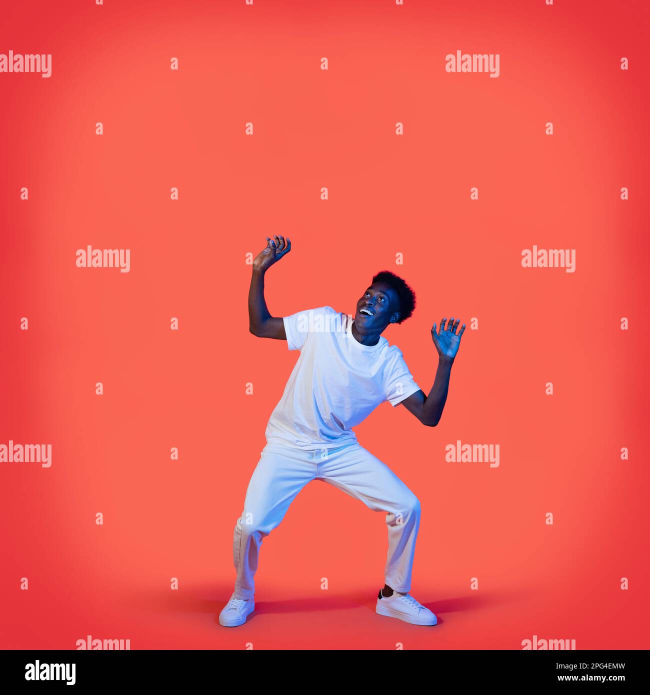 Strong young african man carrying something heavy Stock Photo - Alamy