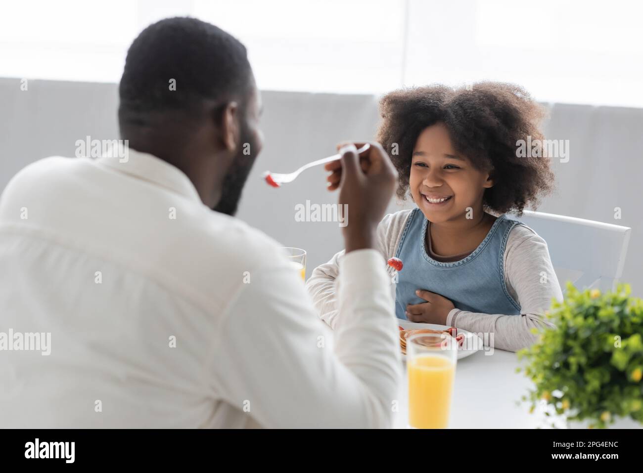 African girl eating breakfast hi-res stock photography and images - Alamy