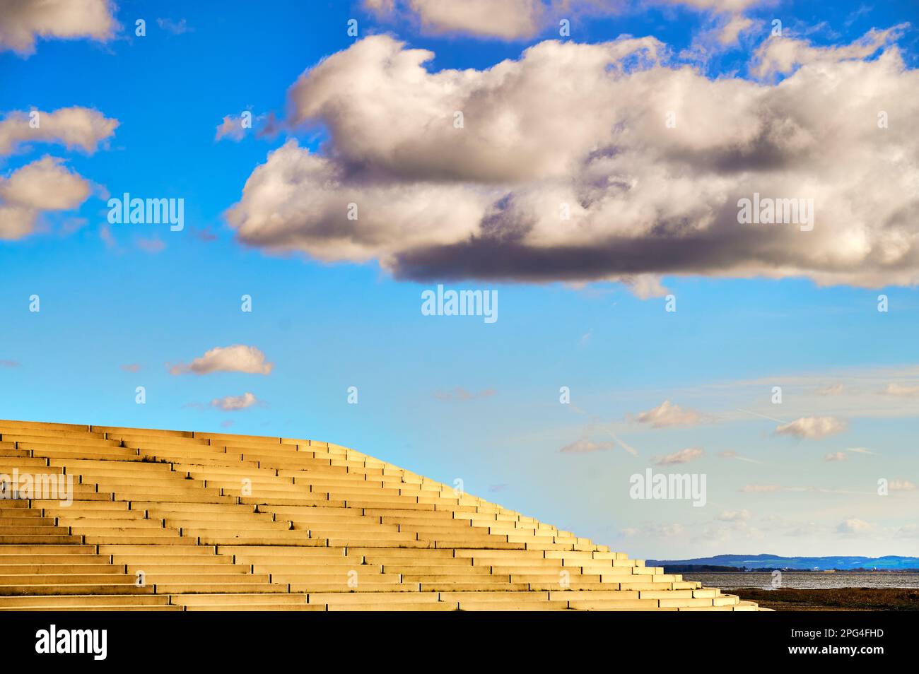 Fluffy cumulus clouds float over the new seawall at Lytham St Annes ...