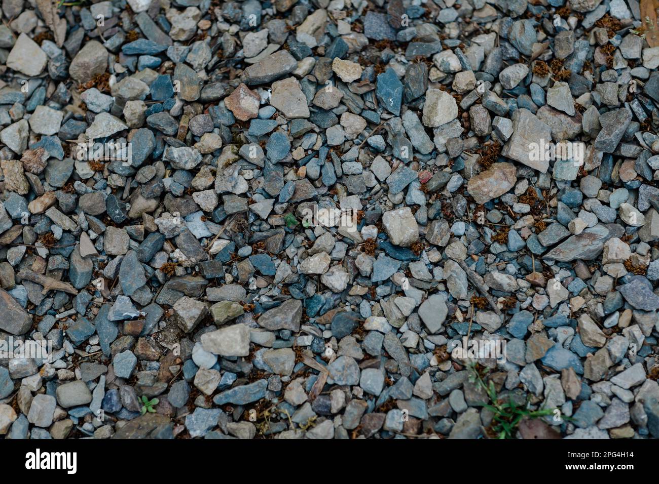 A top view of a ground with small rocks scattered across the surface ...