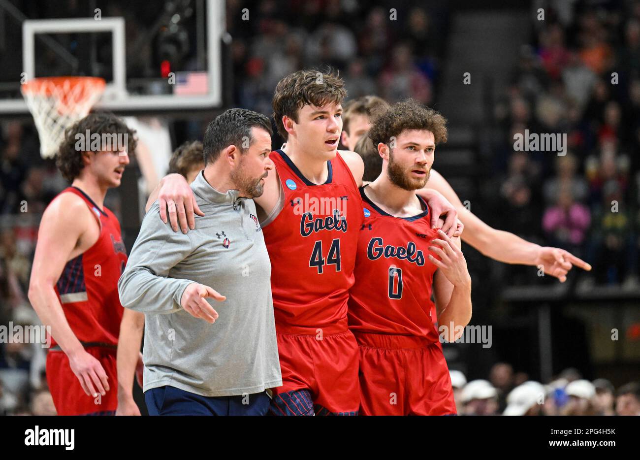 Saint Mary's guard Alex Ducas (44) is helped off the court by a trainer ...