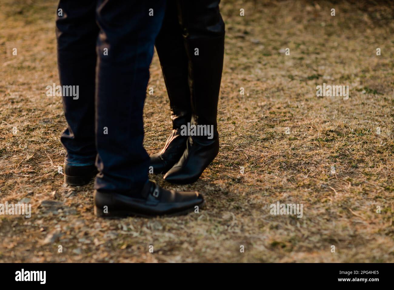 A young couple hugging in a lush outdoor environment Stock Photo - Alamy