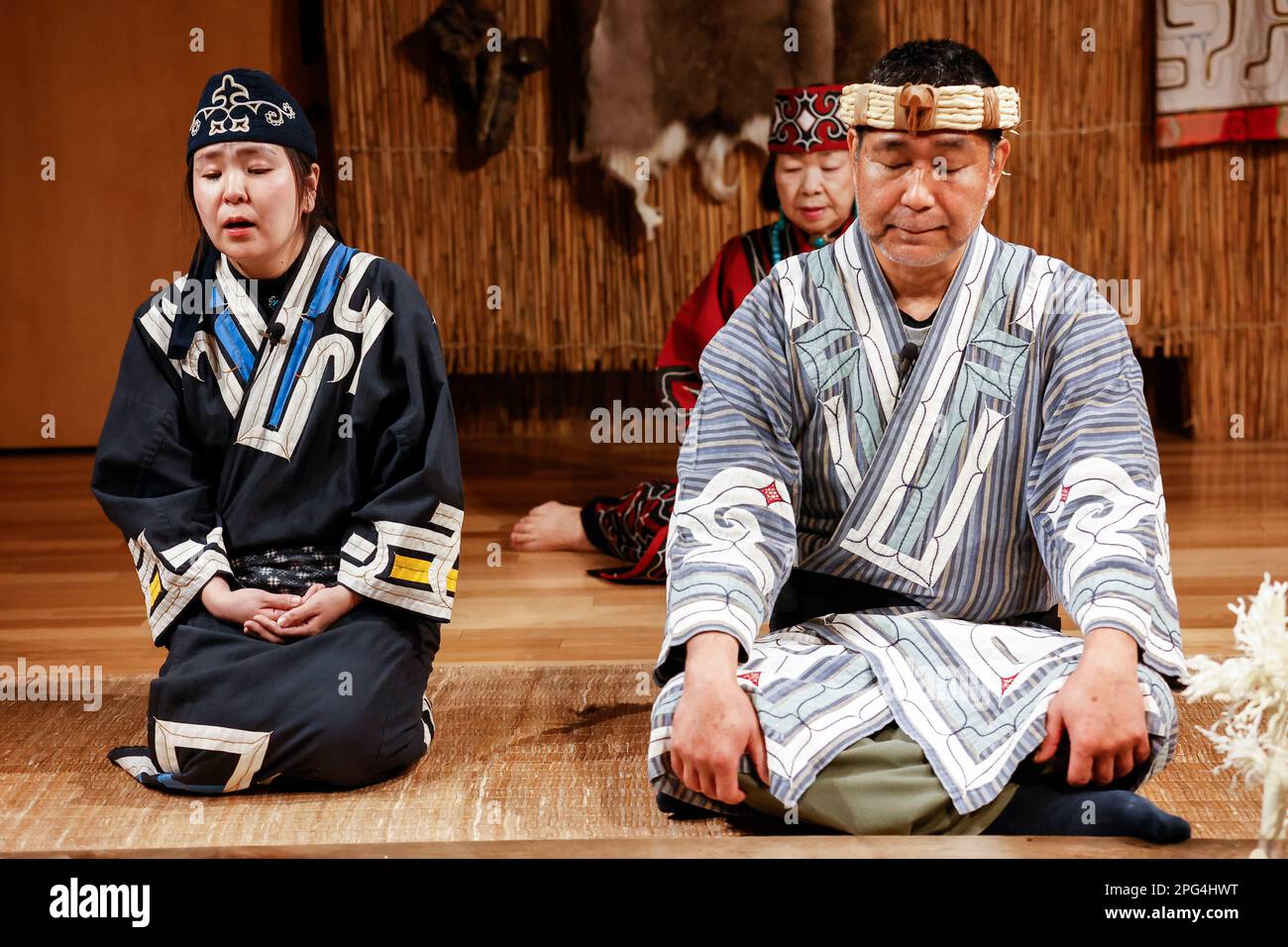 March 16, 2023, Shiraoi, Hokkaido, Japan: An Ainu woman (R) sings a ...