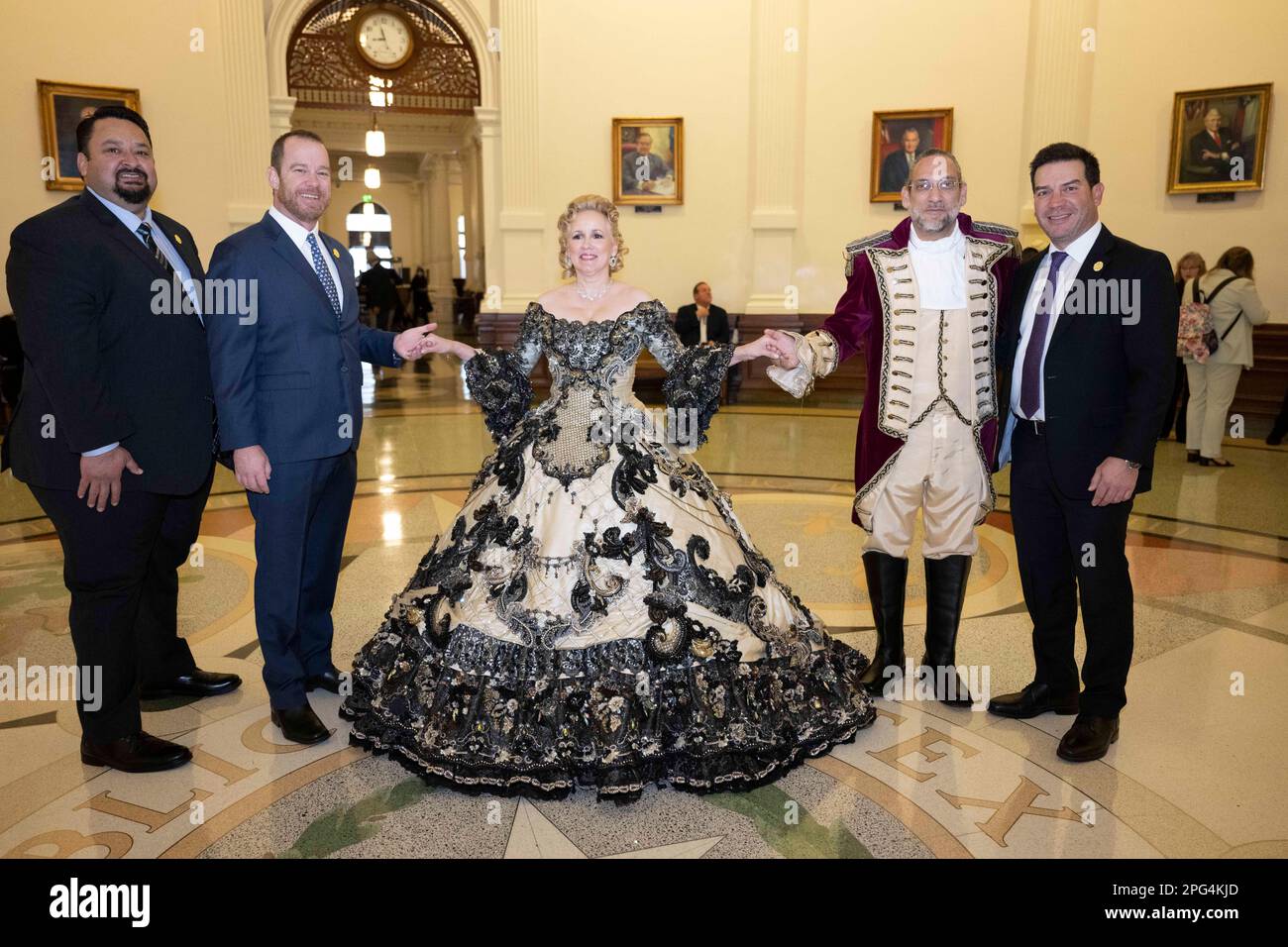 Texans from Laredo pose and parade through the Texas Capitol to promote ...