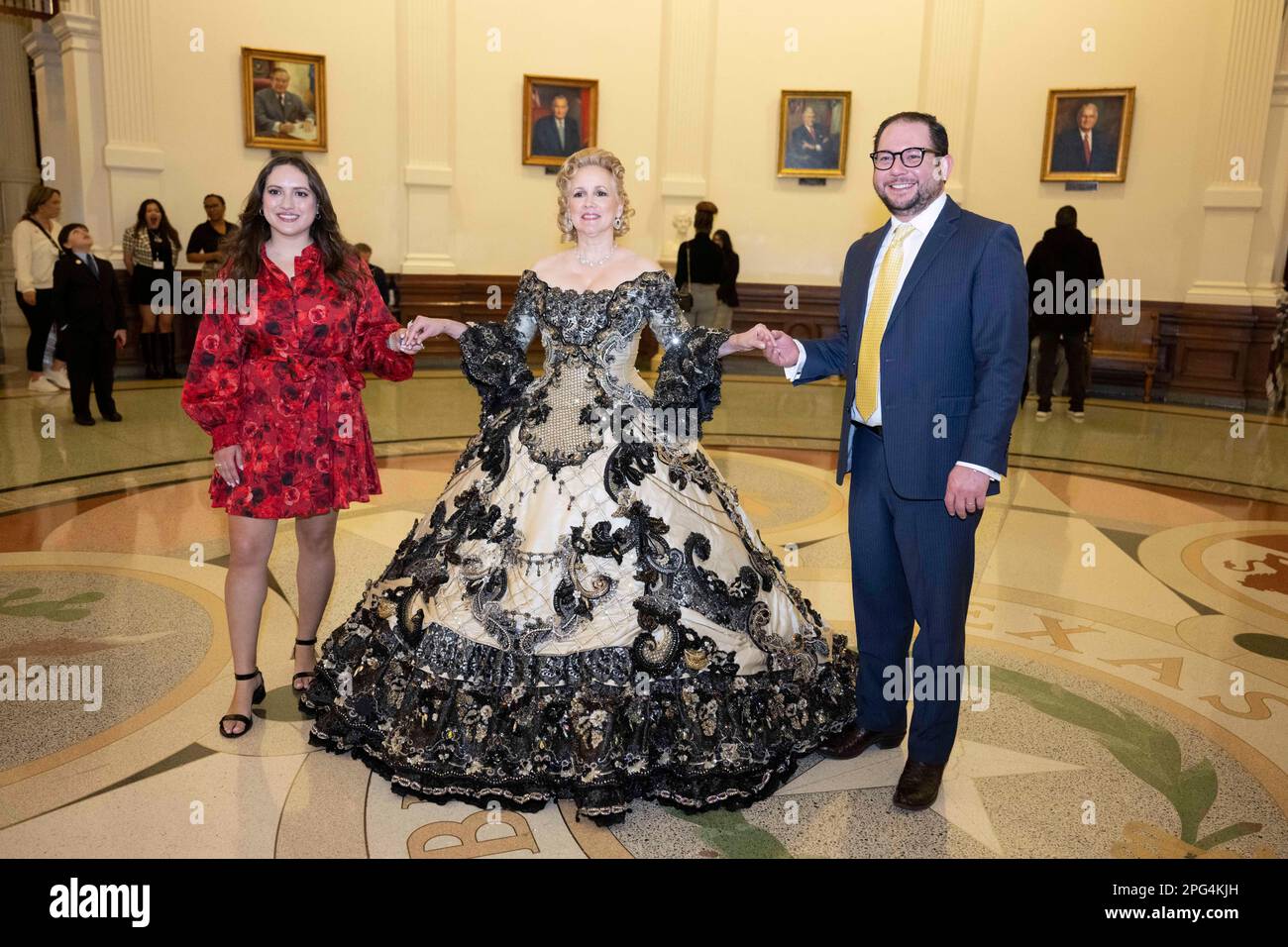 Texans from Laredo pose and parade through the Texas Capitol to promote ...
