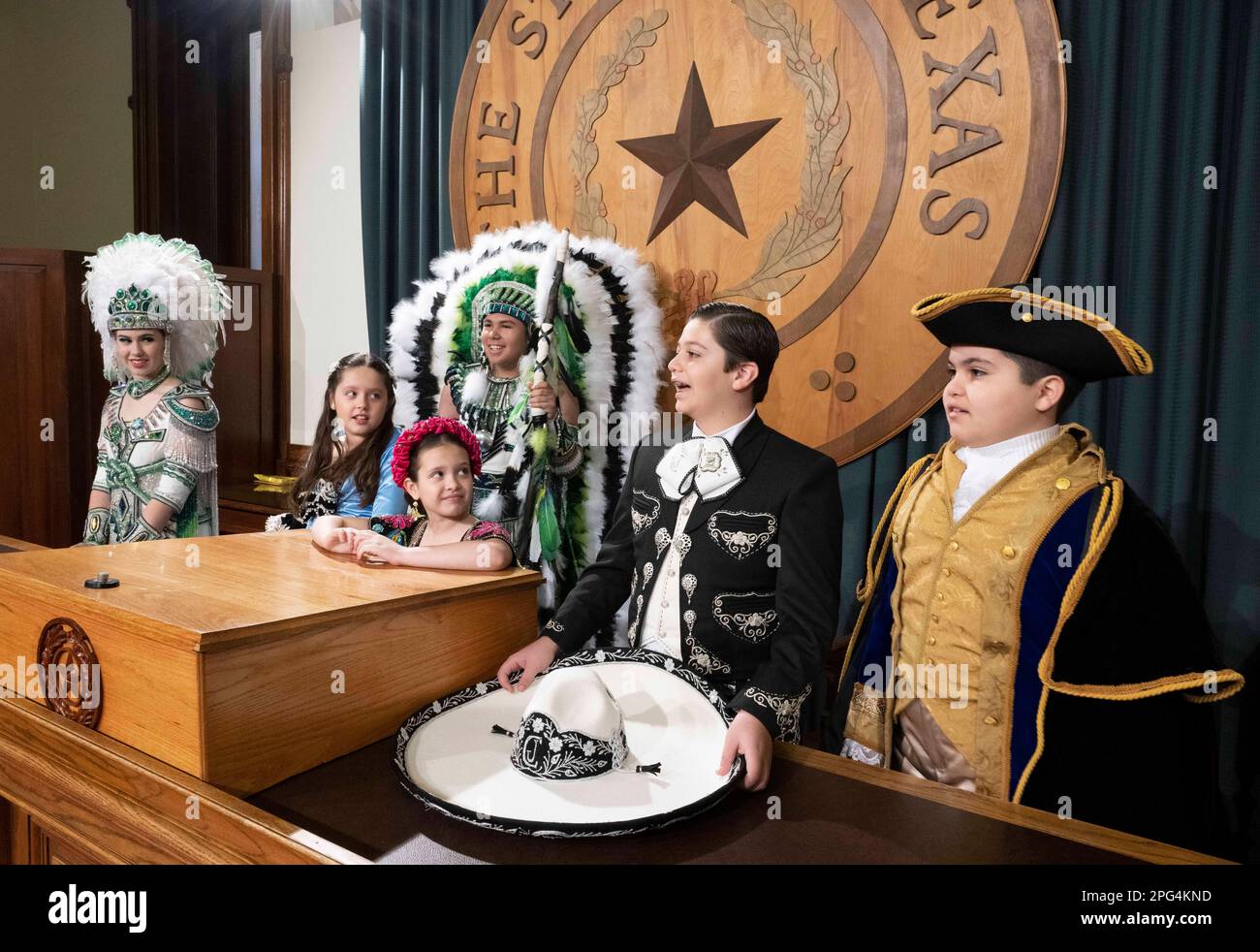 Texans from Laredo pose and parade through the Texas Capitol to promote ...