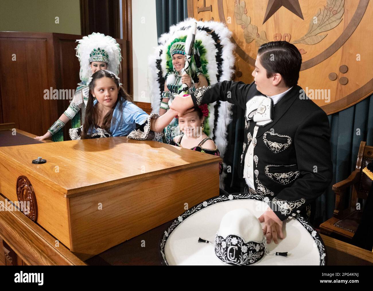 Texans from Laredo pose and parade through the Texas Capitol to promote ...