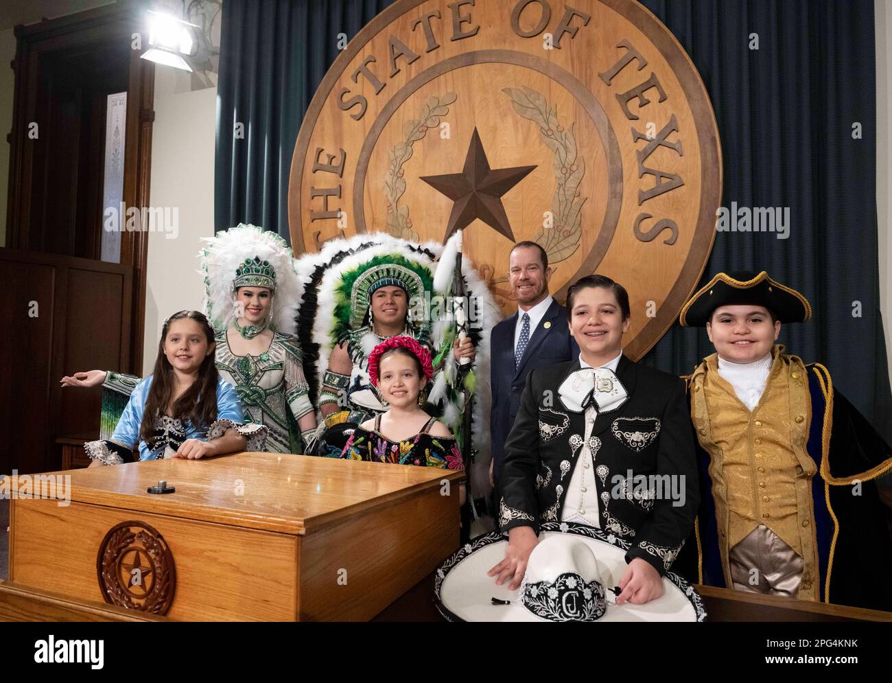 Texans from Laredo pose and parade through the Texas Capitol to promote ...