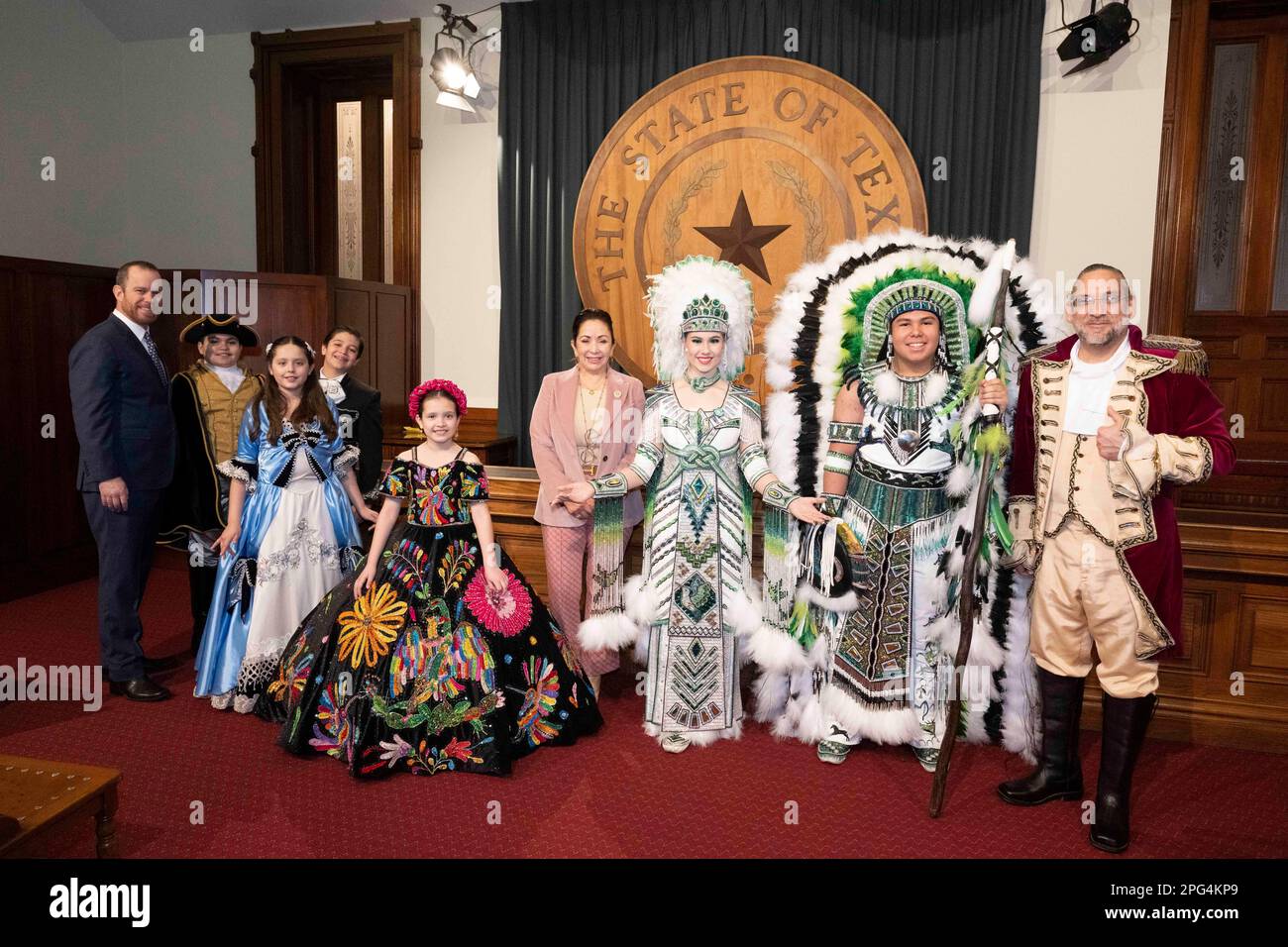 Texans from Laredo pose and parade through the Texas Capitol to promote ...