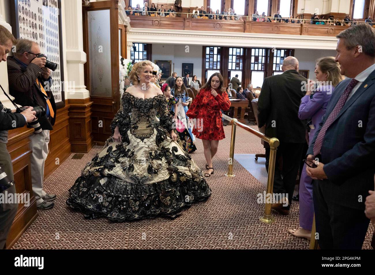 Texans from Laredo pose and parade through the Texas Capitol to promote ...