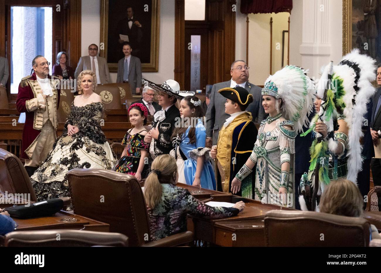 Texans from Laredo pose and parade through the Texas Capitol to promote ...