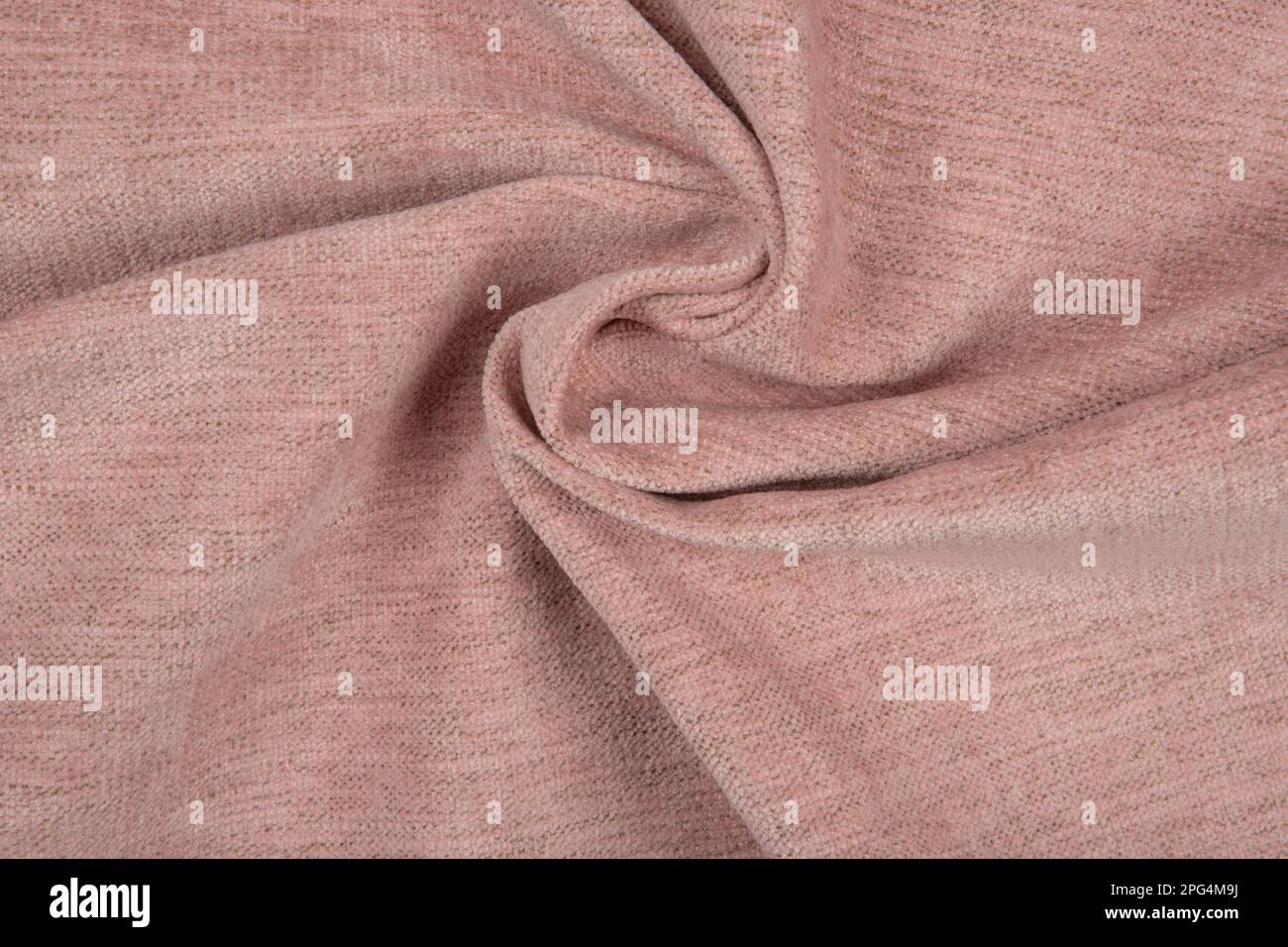 Pink fabric texture - top view and close-up of a piece of crushed and ...