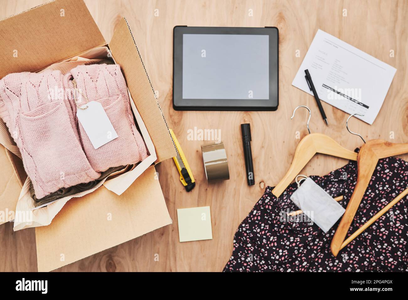 Packing online order to delivery to customer. Preparing parcel box with ...