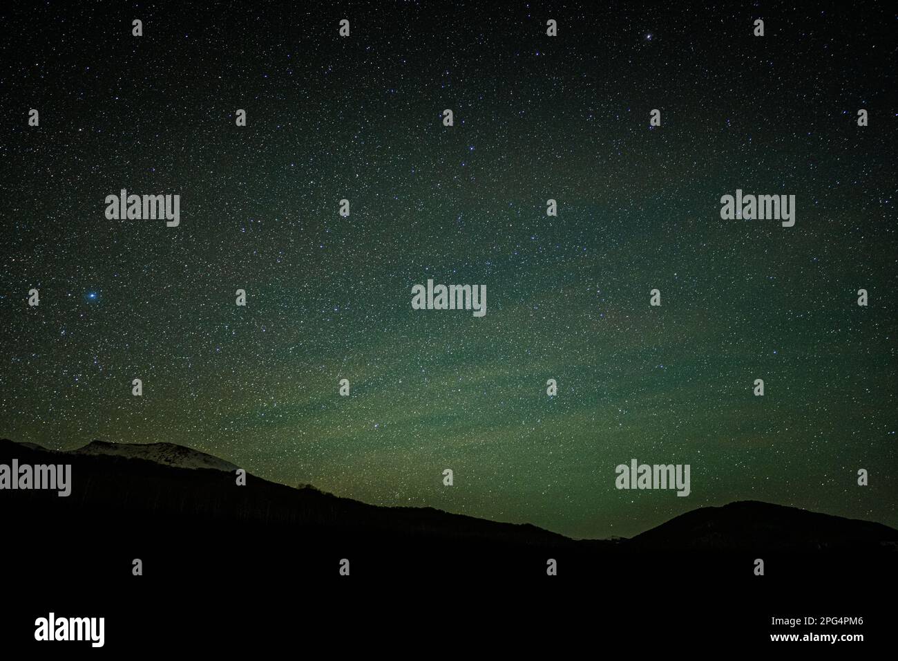 Sky full of stars over the mountains. No light pollution. Dark sky park ...